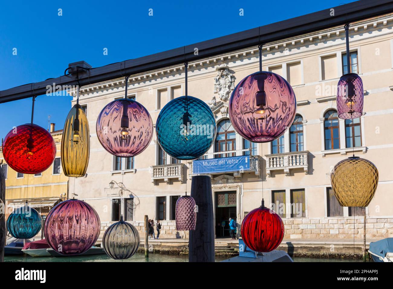 Murano glass lights with reflections hanging opposite Museo del Vetro Murano Glass Museum at ...
