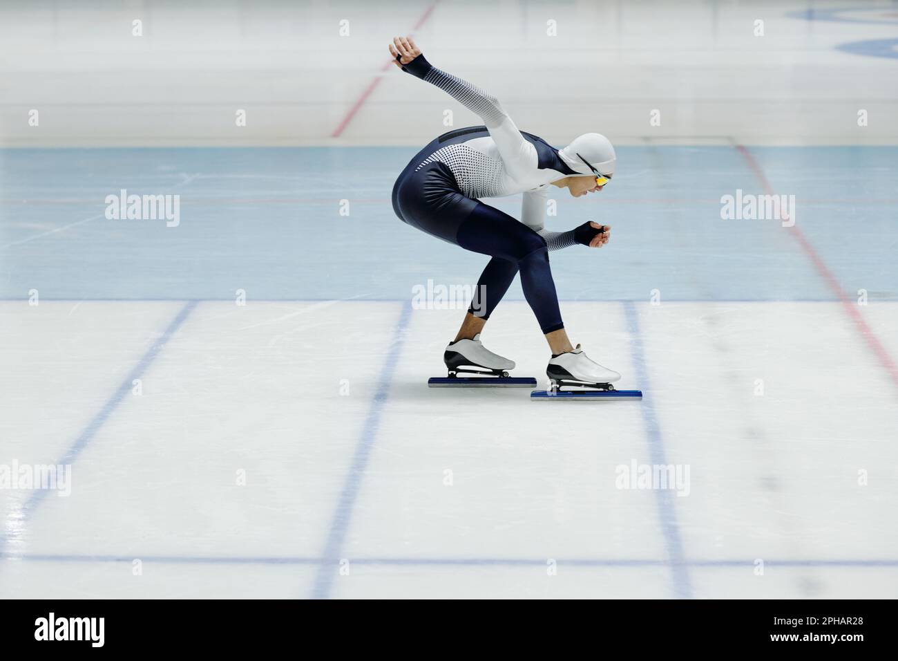 Side view of young athlete in sports uniform bending forwards while ...