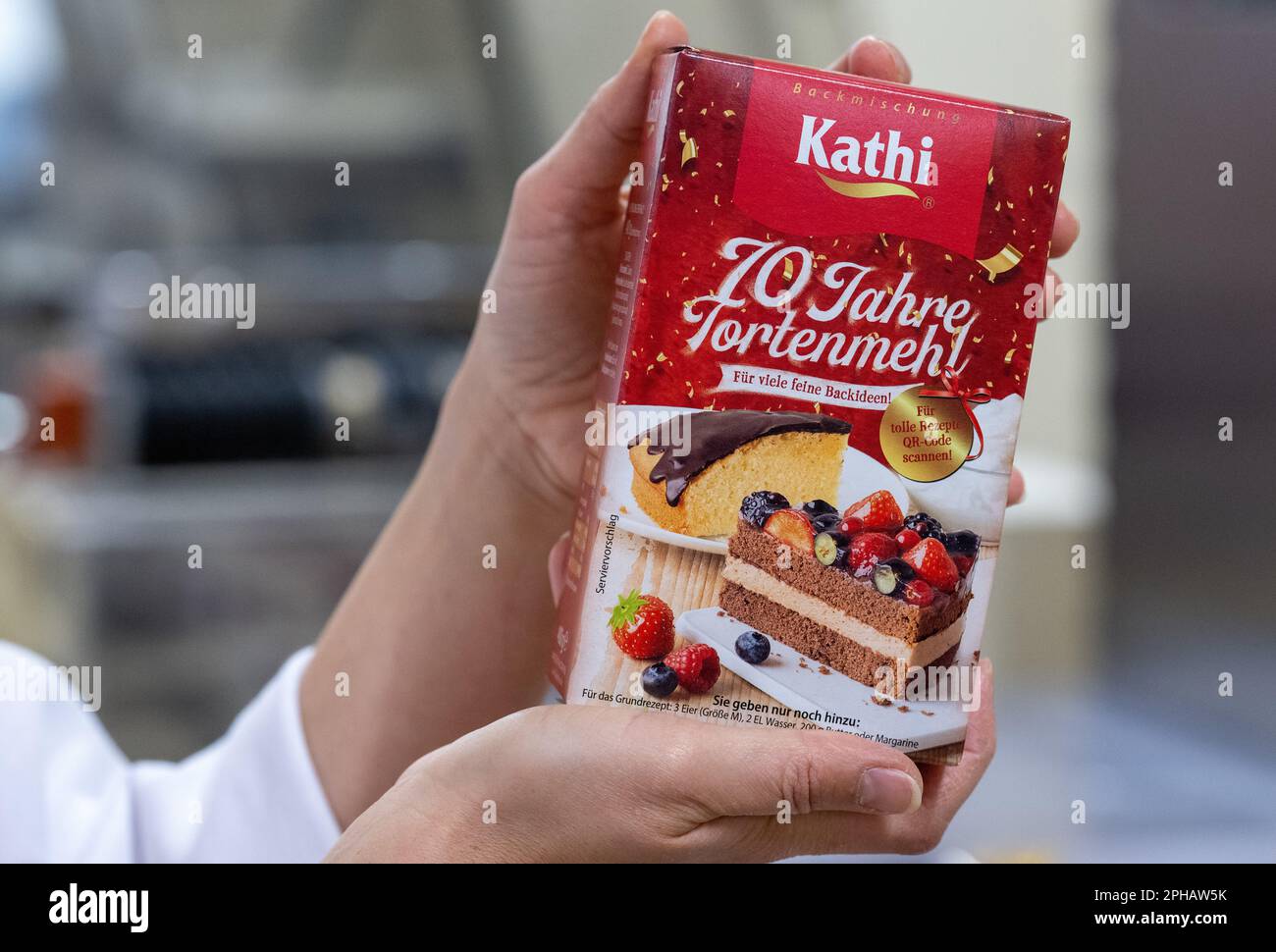 27 March 2023, Saxony-Anhalt, Halle (Saale): An employee of Kathi ...