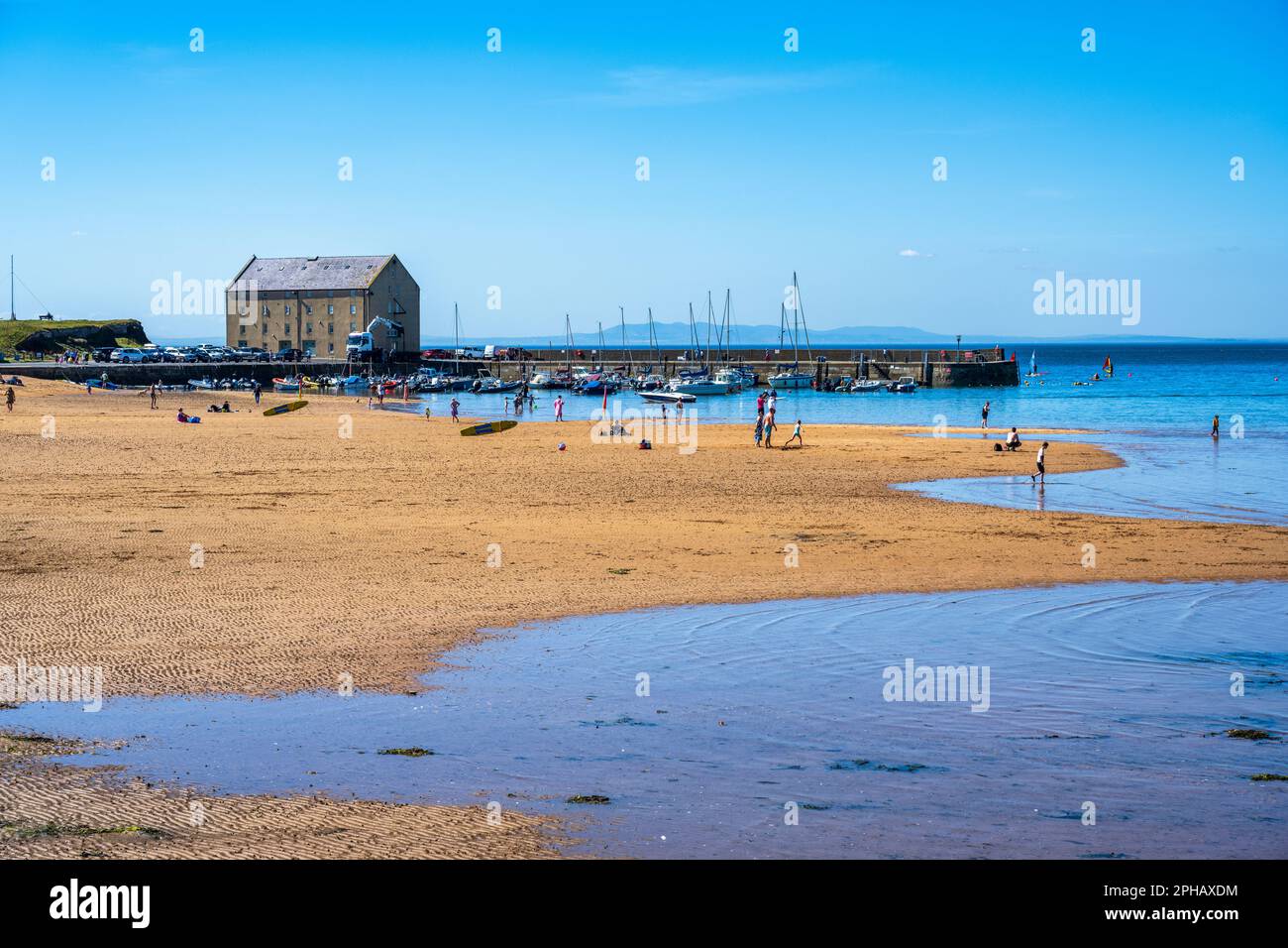 View across Elie beach, with holidaymakers enjoying the summer sunshine ...