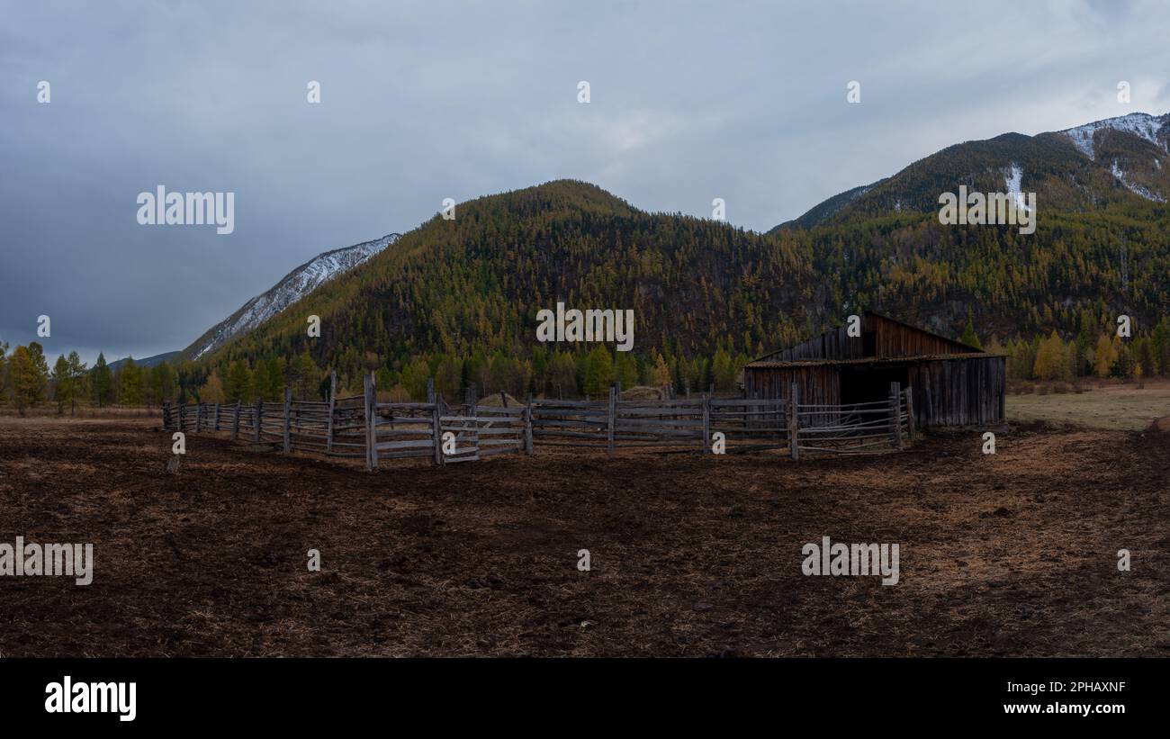 Corral with a barn for animals and hay in the mountains in the Altai in ...
