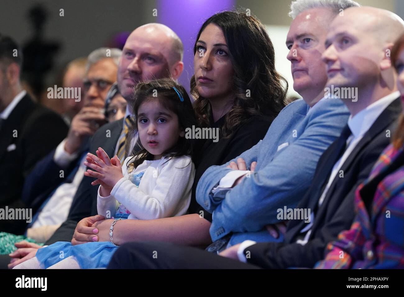 Humza Yousaf's wife Nadia El-Nakla listens to him speaking at ...
