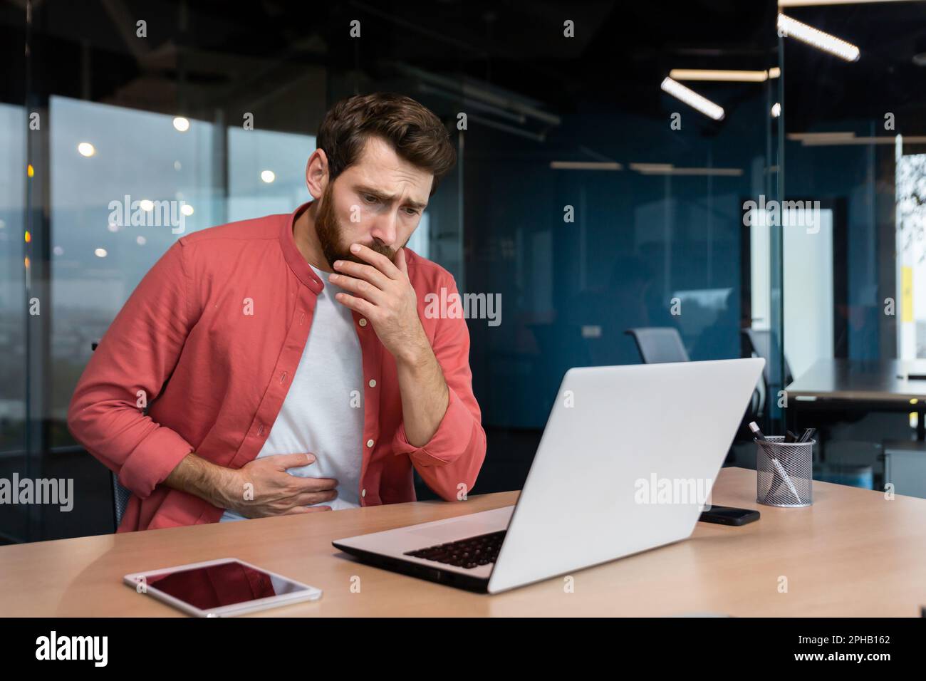 Man stomach ache table hi-res stock photography and images - Alamy