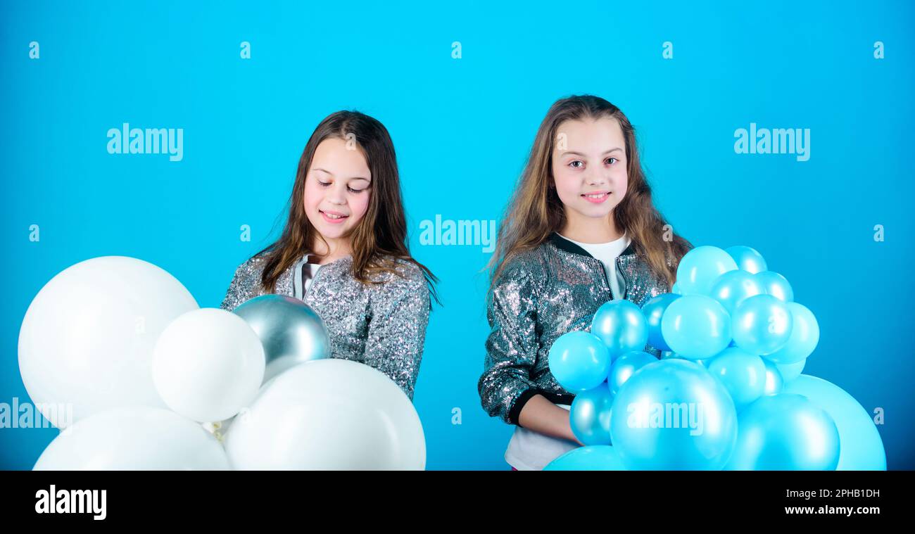 Time for fun. Adorable girls enjoy party time. Happy girls holding ...