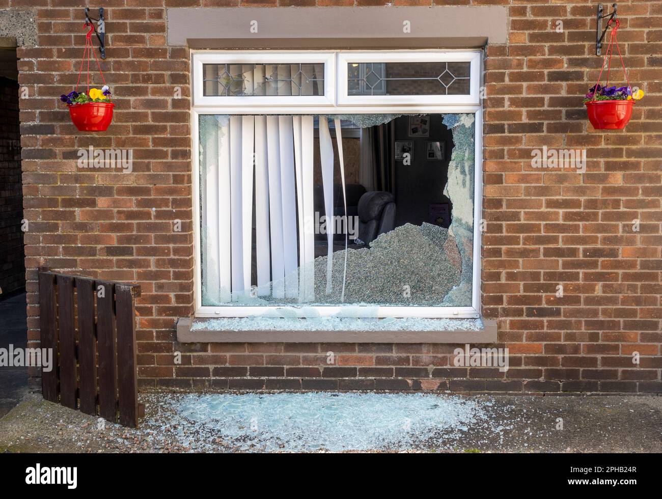 The smashed window of a property in the Moyne Gardens area of ...