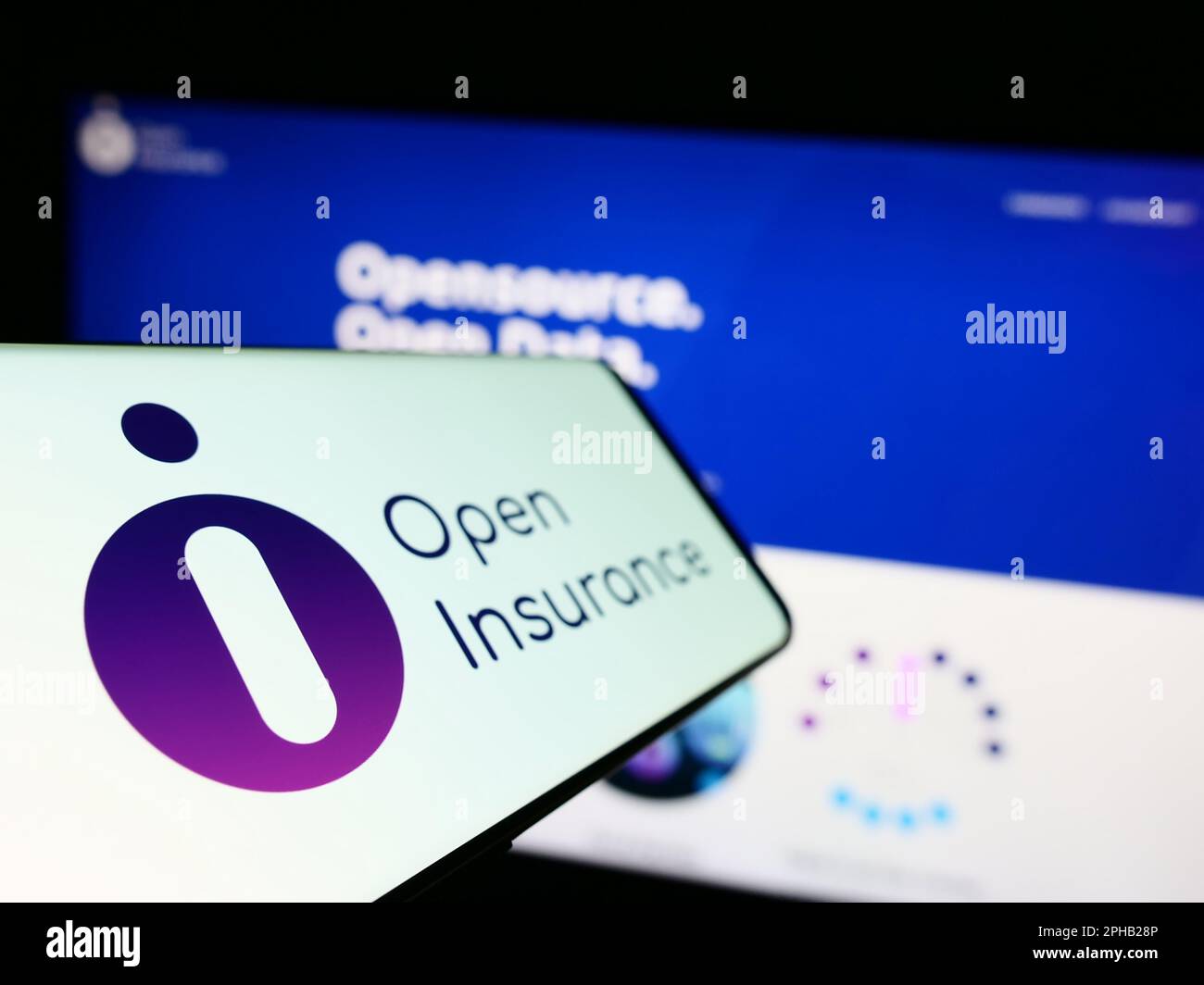 Mobile phone with logo of industry initiative Open Insurance on screen ...