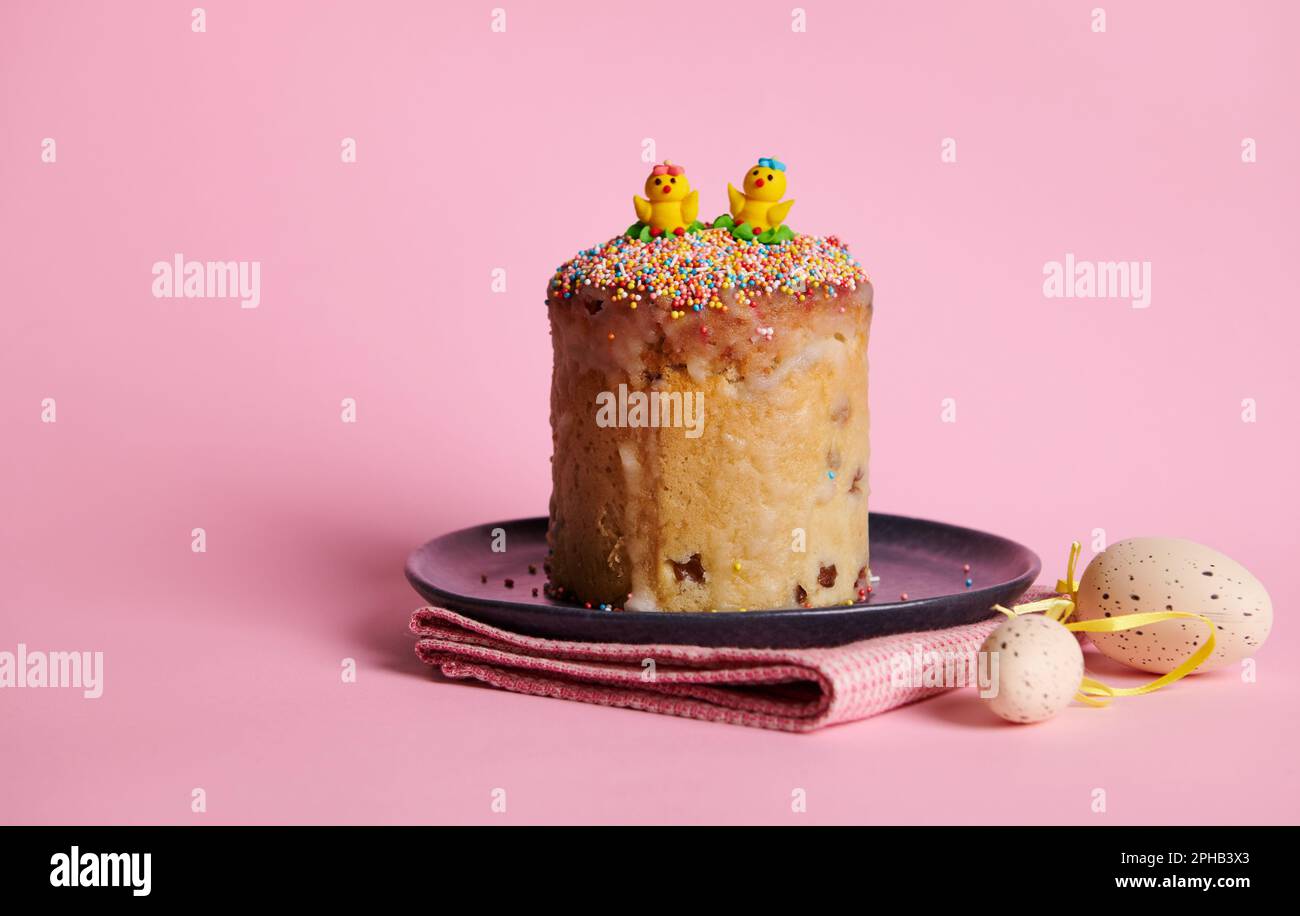 Still life. Easter cake and eggs, pink backdrop. Celebrating religious ...