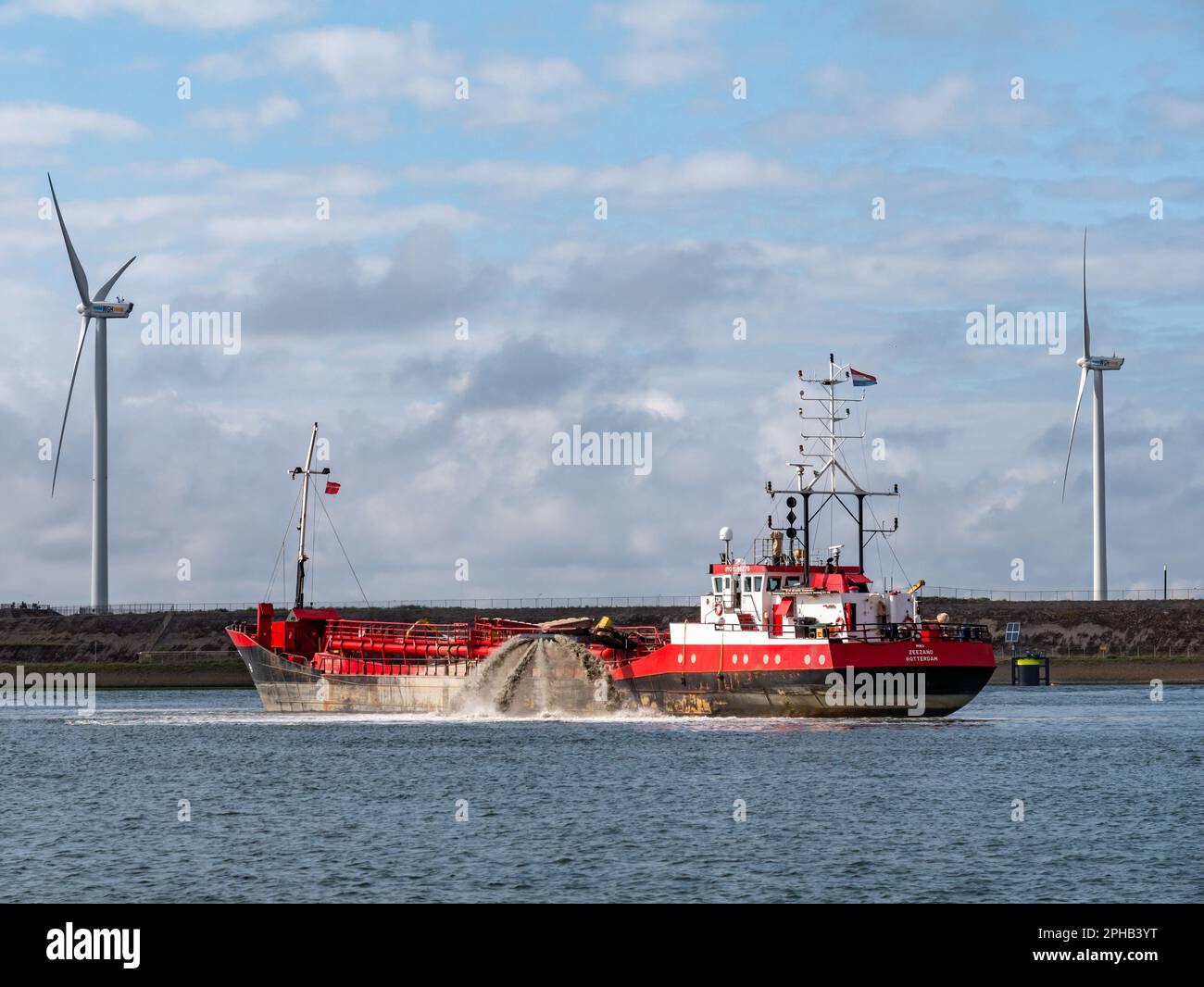 Trailing suction hopper dredger ship dredging in harbour of IJmuiden ...