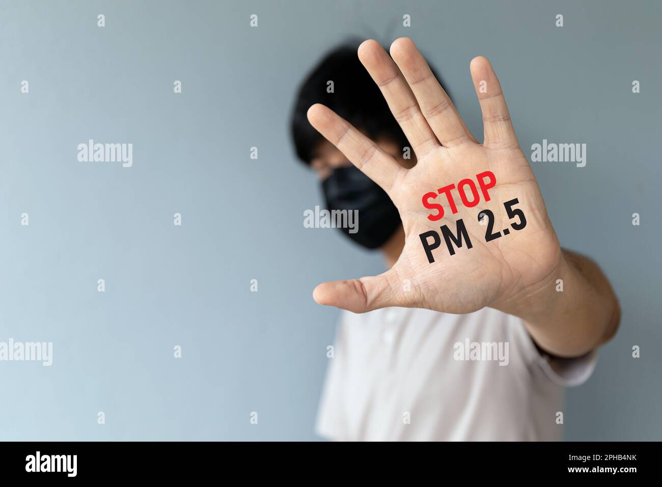 men wearing a mask to protect air pollution and PM2.5 dust with showing ...