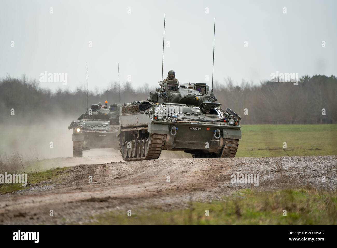 two British army FV510 Warrior Fighting Vehicles manoeuvre on a ...