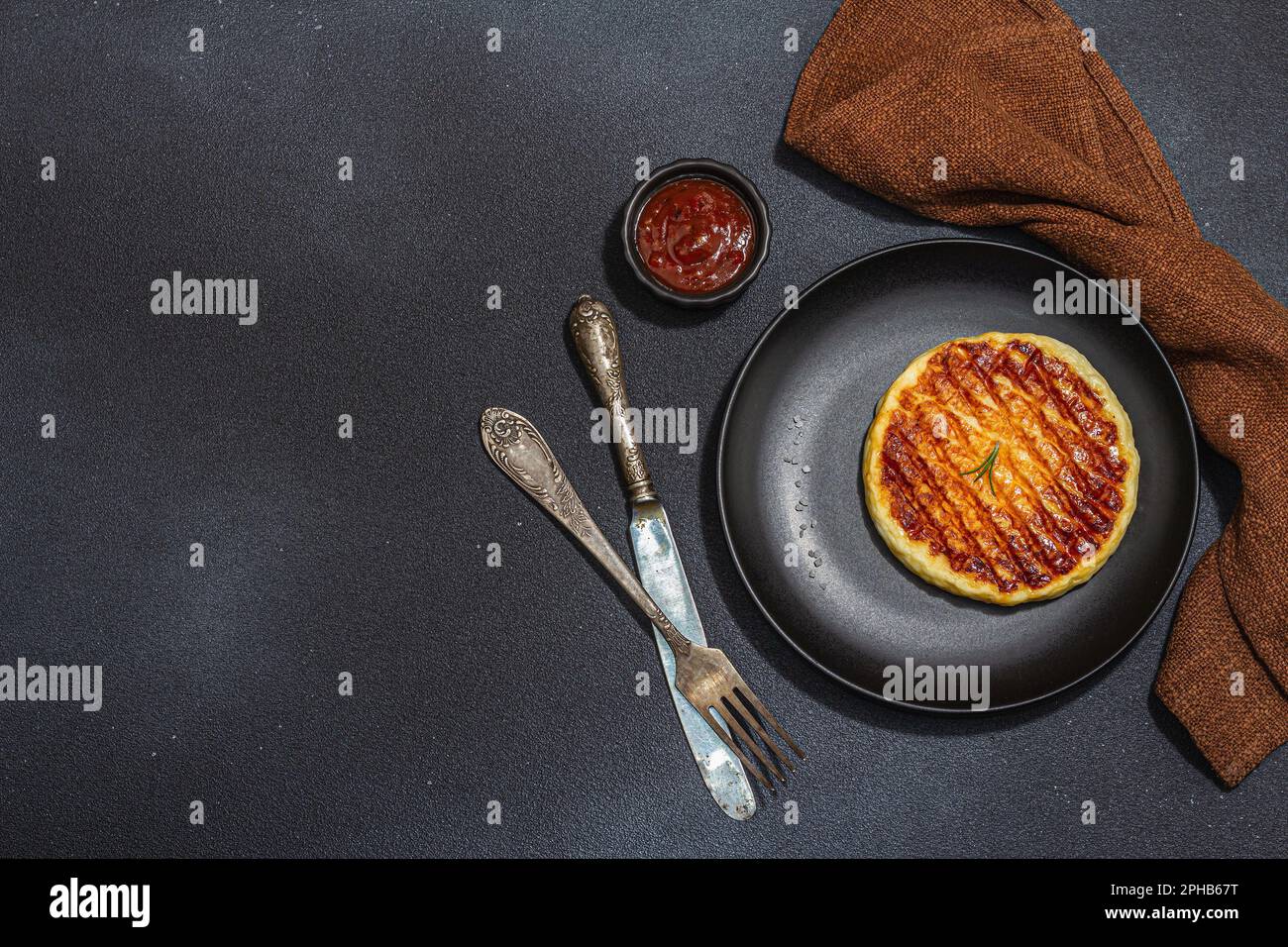 Grilled Halloumi cheese served on plate. Cutlery, traditional food for ...