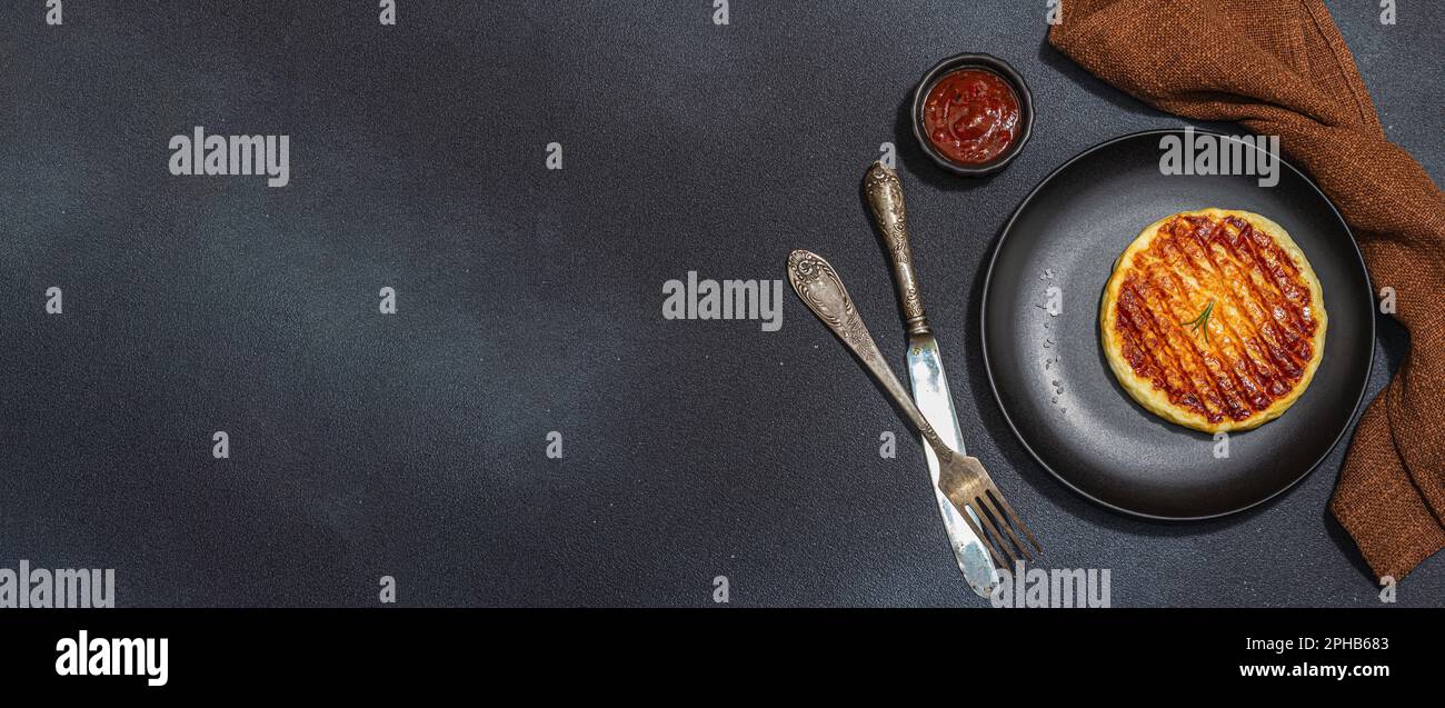 Grilled Halloumi cheese served on plate. Cutlery, traditional food for ...