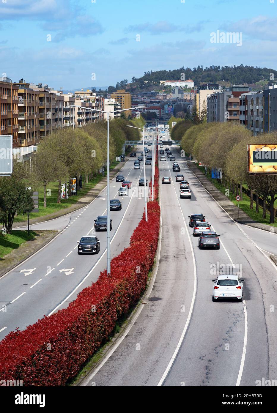 Wide avenue with fast lanes in both direction in a gorgeous springtime ...