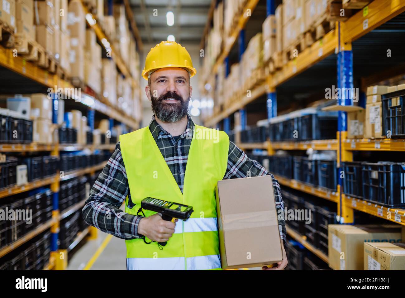 Warehouse worker stocking goods in a warehouse Stock Photo - Alamy