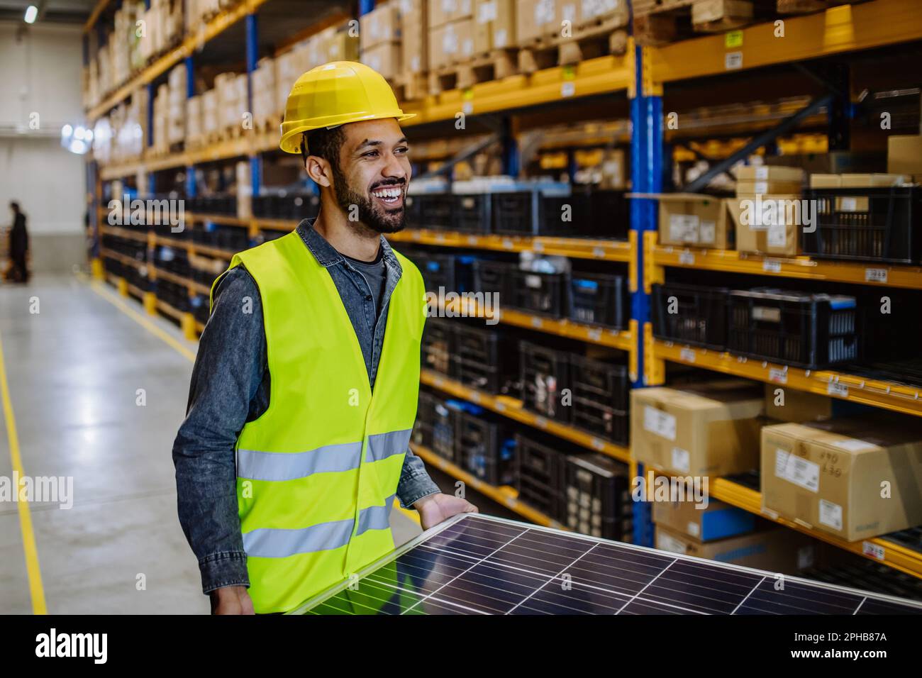 Portrait of warehouse worker carring solar panel Stock Photo - Alamy