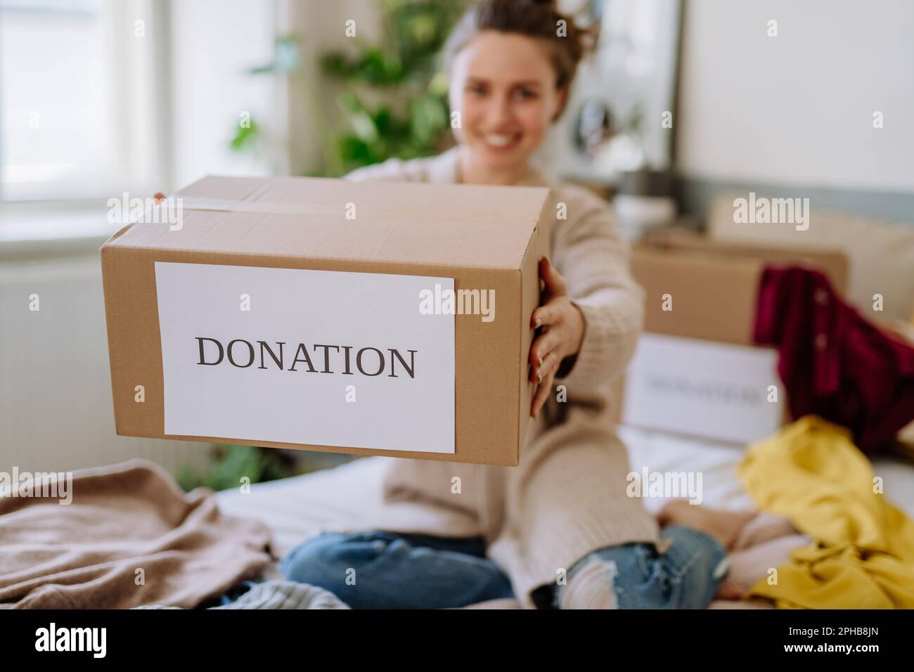 Woman organising clothes wardrobe hi-res stock photography and images ...
