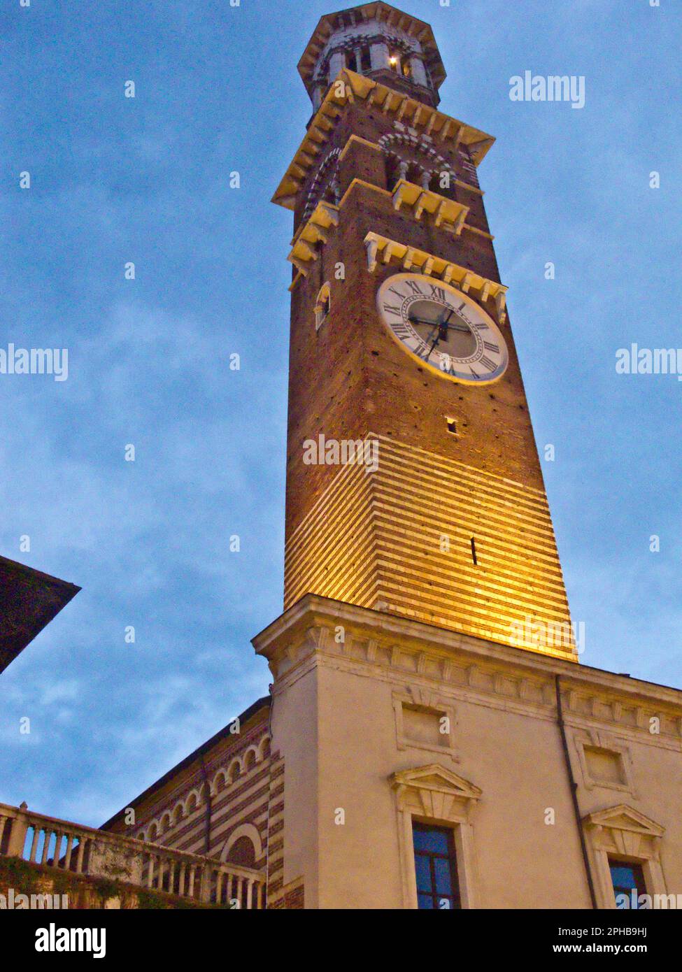 Torre dei Lamberti, Piazza delle Erbe, Verona. Evening. Clock added in ...