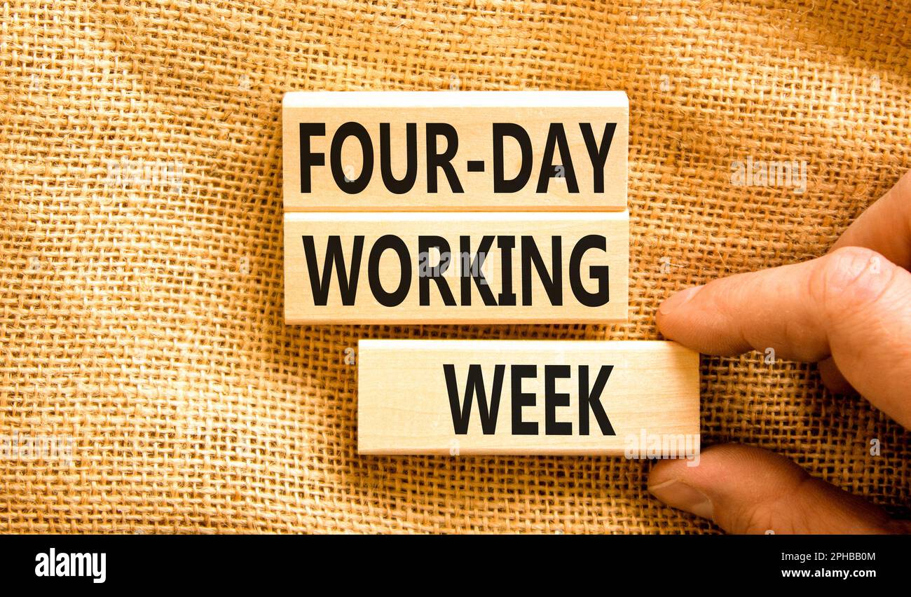 Four-day working week symbol. Concept words Four-day working week on wooden block on a beautiful ...
