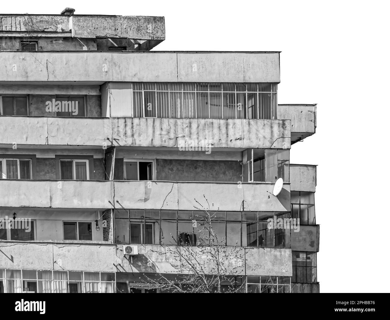 Worn out apartment building from the communist era against blue sky in ...