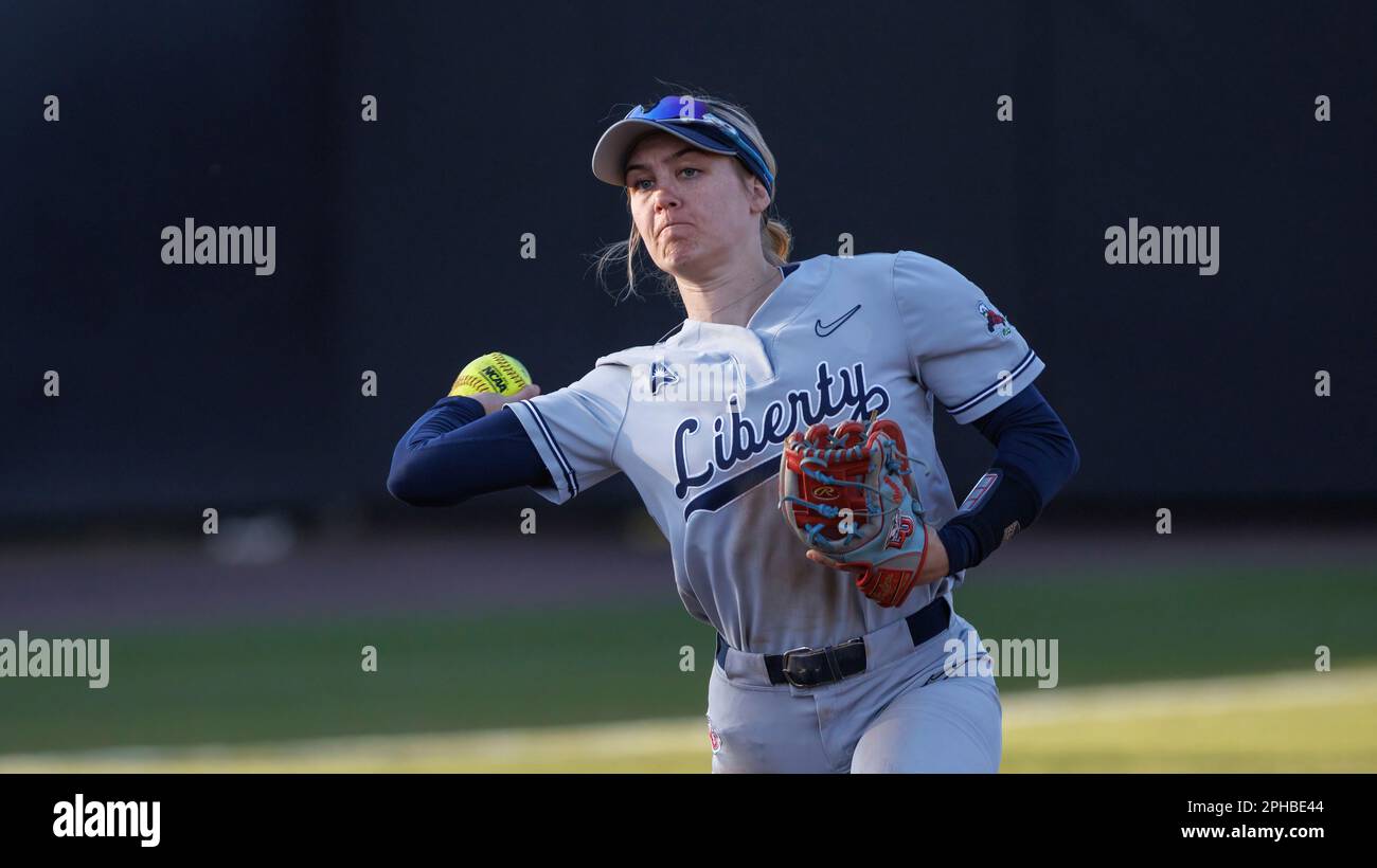 Liberty's Devyn Howard (11) makes a throw during an NCAA softball game ...