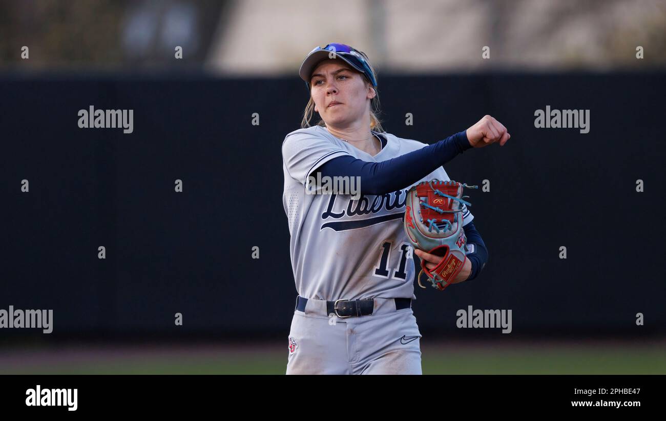 Liberty's Devyn Howard (11) makes a throw during an NCAA softball game ...