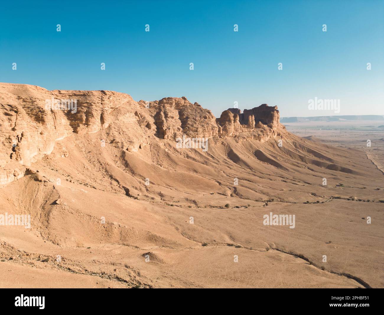 A stunning vista of an arid, dry desert landscape with an expansive ...