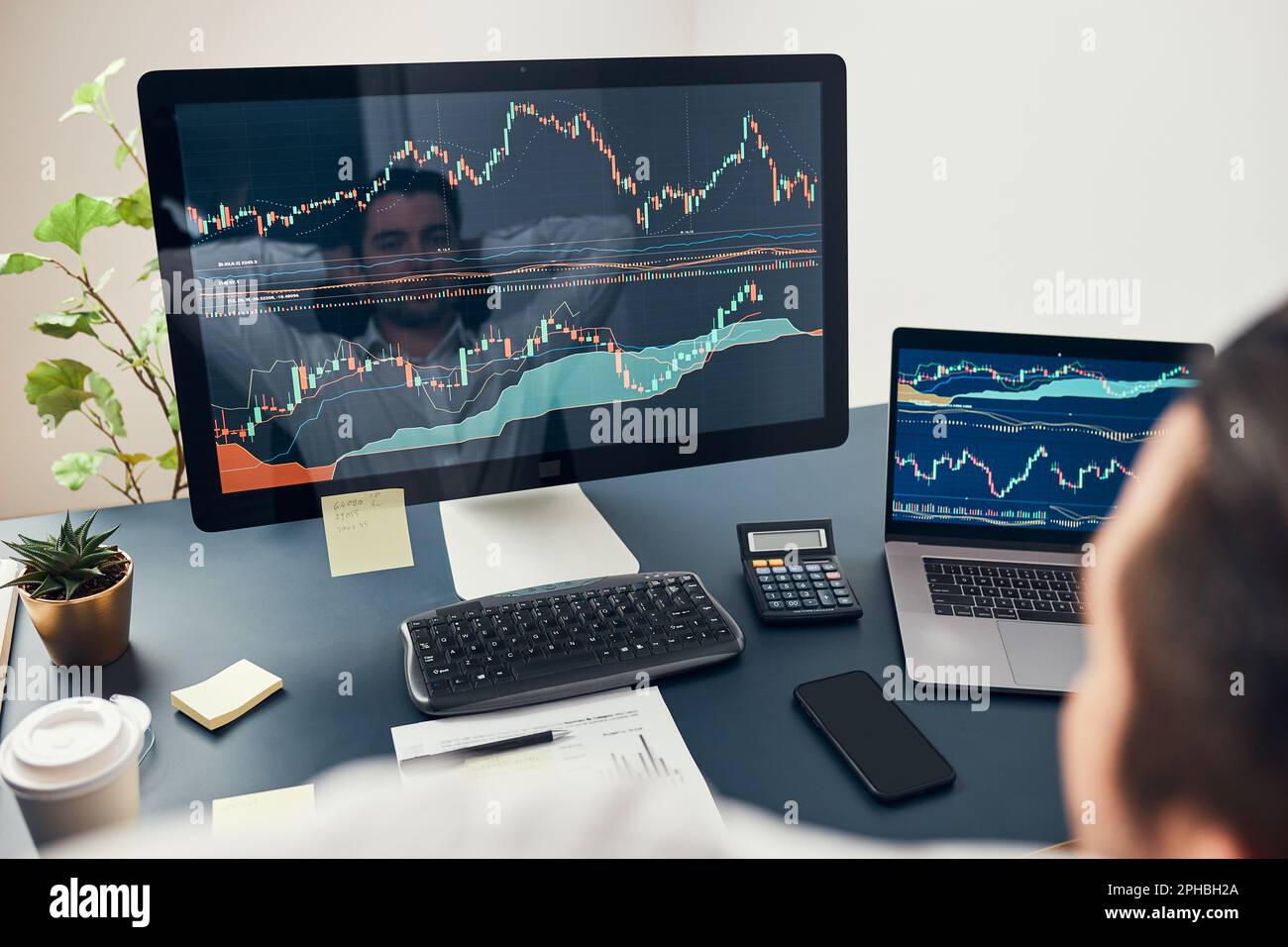 Businessman trading stocks online. Stock investor analysing numbers at ...