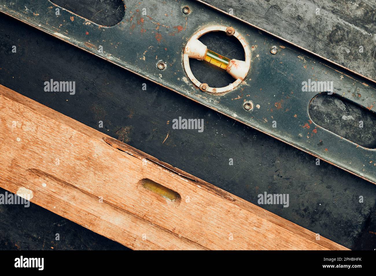 Level tool. Wooden and metal levels close up. Tools on metal surface ...