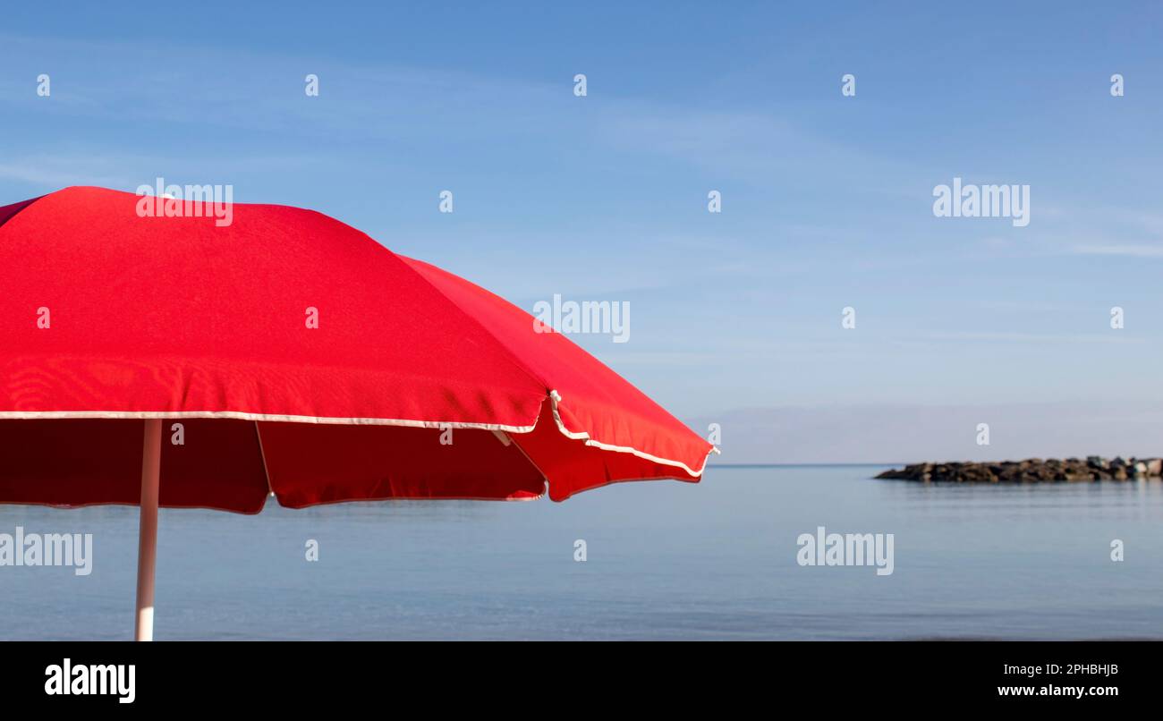 Red Beach Umbrella on the Background of the Blue Ocean. Beach Landscape ...