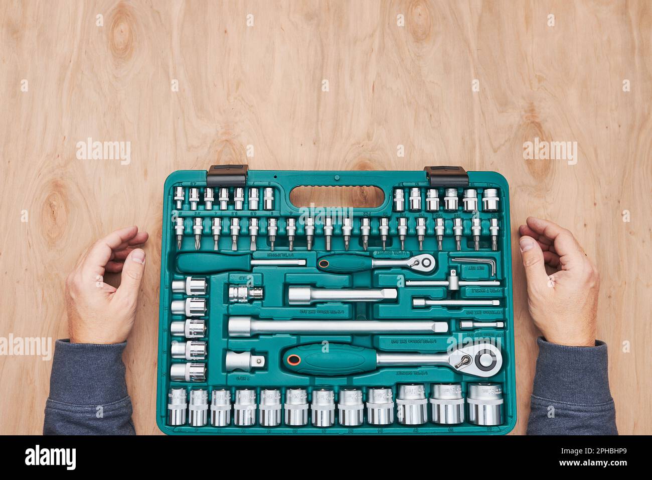Man preparing tools in workshop. Wrench, spanner and ratchet with many ...