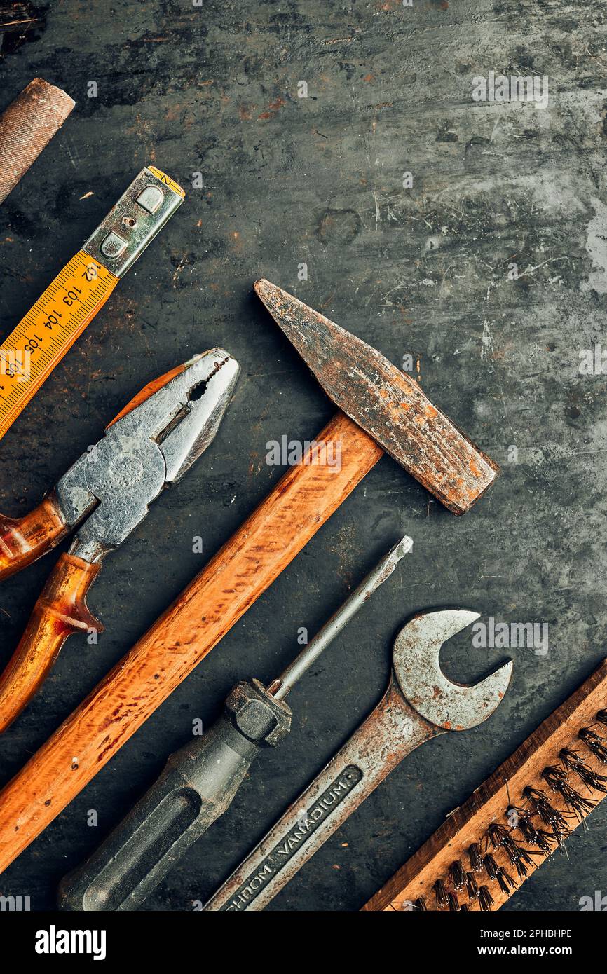 Old hardware tools. Wrench, screwdriver, measure, hammer, pliers on ...