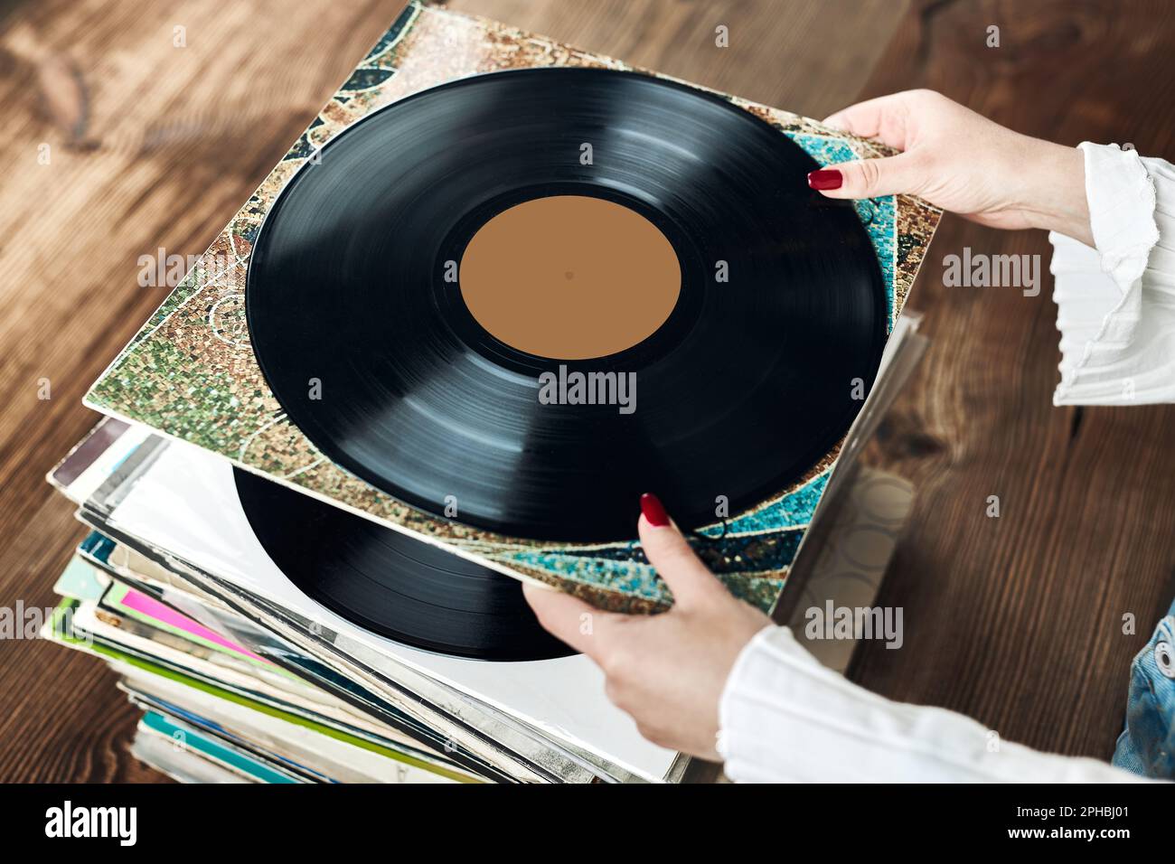 Playing vinyl records. Listening to music from vinyl record player ...