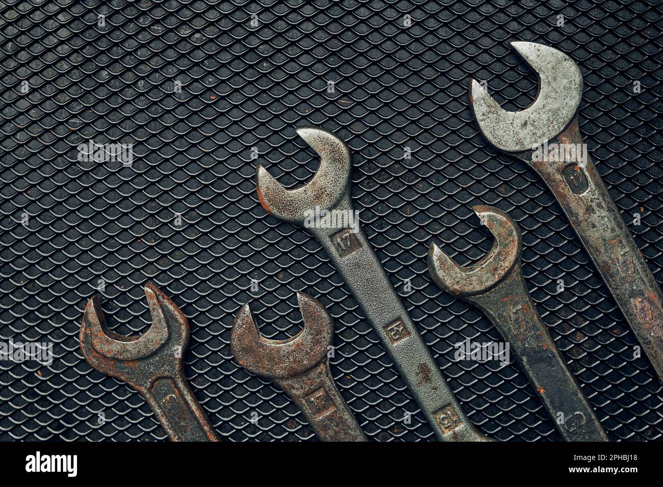 Spanners on steel surface. Old rusty wrenches for maintenance. Mechanic ...