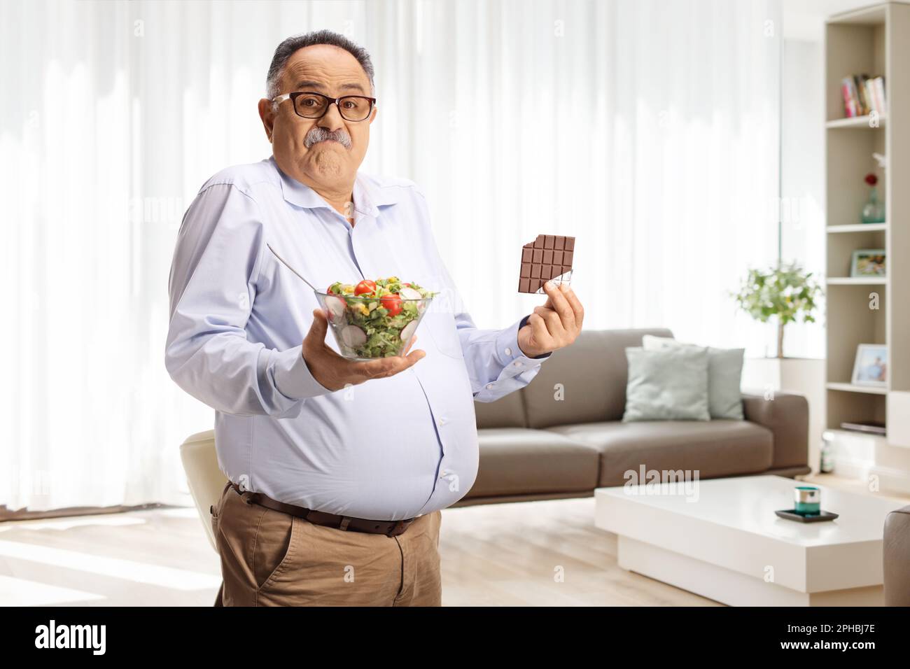Elderly people eating chocolate hi-res stock photography and images - Alamy