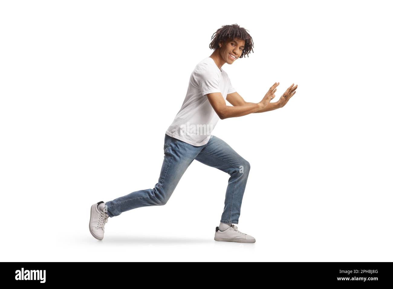 Young african american man standing and pushing something isolated on ...