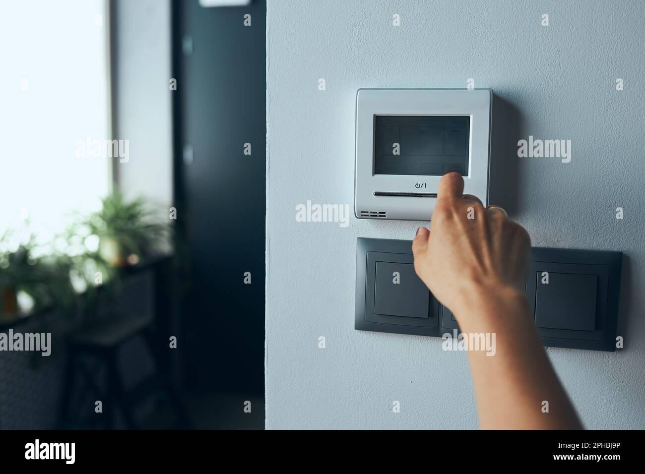 Woman controlling office with digital touch screen panel installed on ...