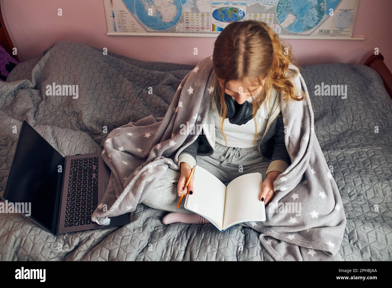 Student learning remotely from home. Young woman having classes online ...