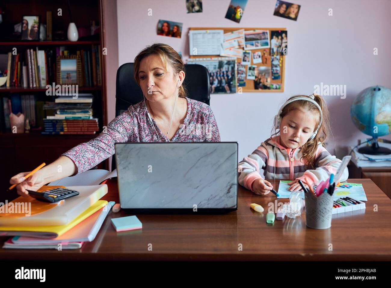 Woman mother working doing her job remotely during video chat call ...