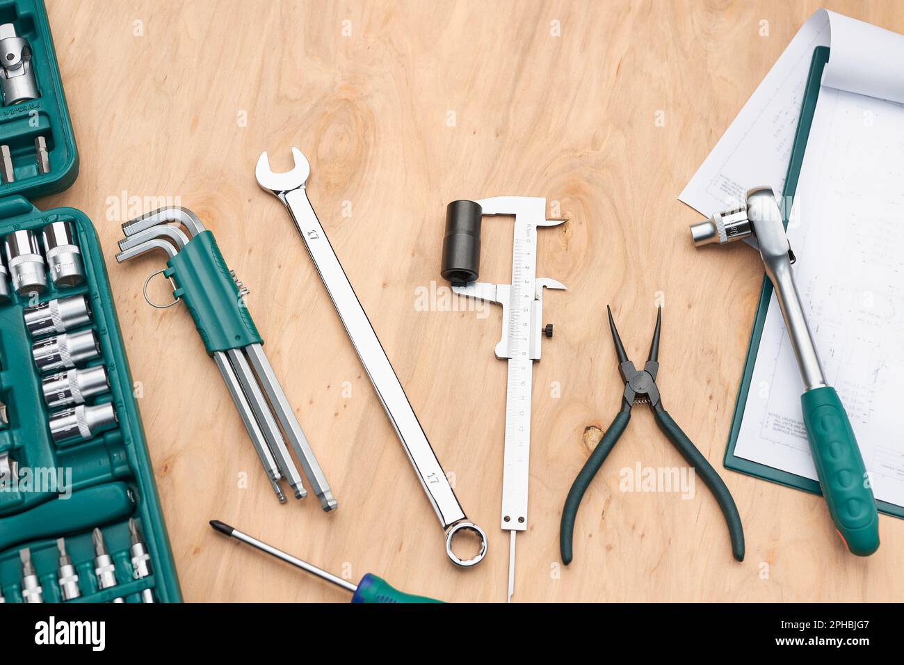 Workshop table with many tools. Wrench, spanner, calliper and ratchet ...
