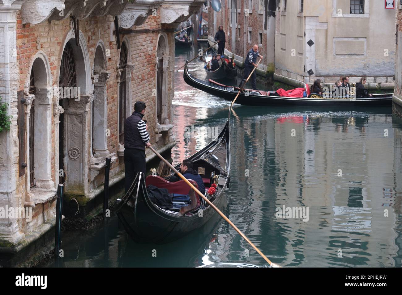 gondoliers row their own gondolas along the canals of venice Gondoliers ...