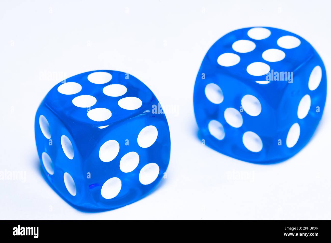 two blue dices on white background for design purpose Stock Photo - Alamy