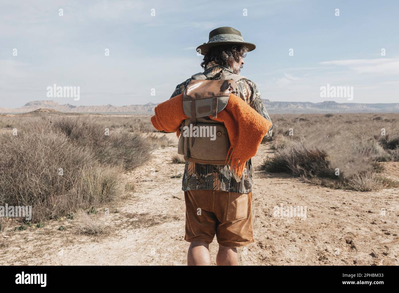 Rear View Of A Man With A Backpack In The Bardenas Desert. Navarre ...