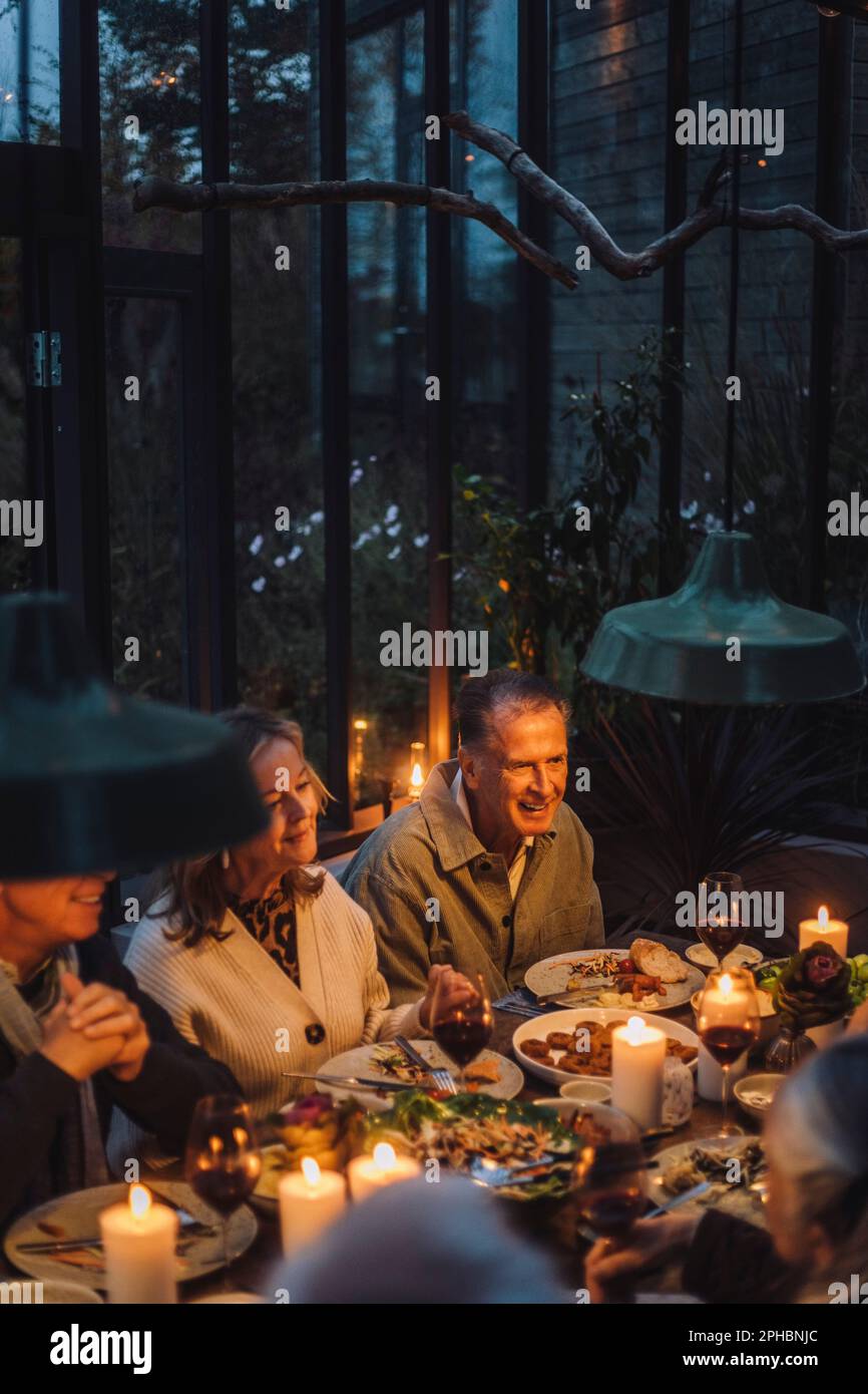 Happy friends having dinner hi-res stock photography and images - Alamy