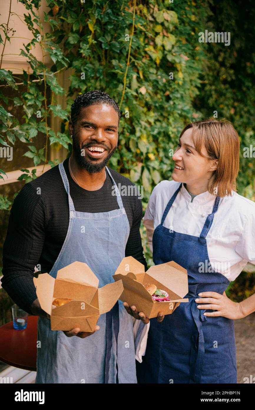 Women chef holding boxes hi-res stock photography and images - Alamy