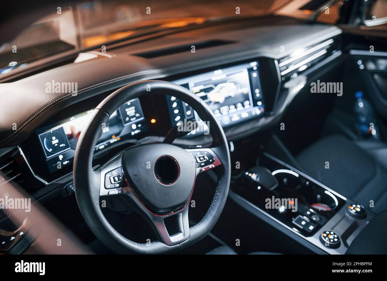 Steering wheel and navigation display. Close up view of front park of ...