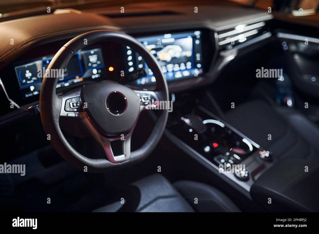Steering wheel and navigation display. Close up view of front park of ...