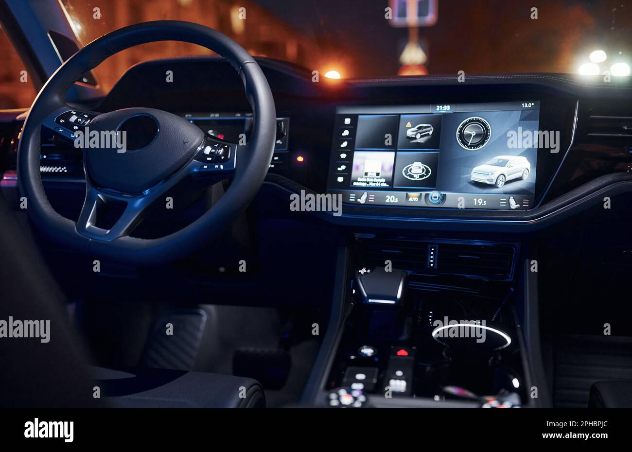 Steering wheel and navigation display. Close up view of front park of ...