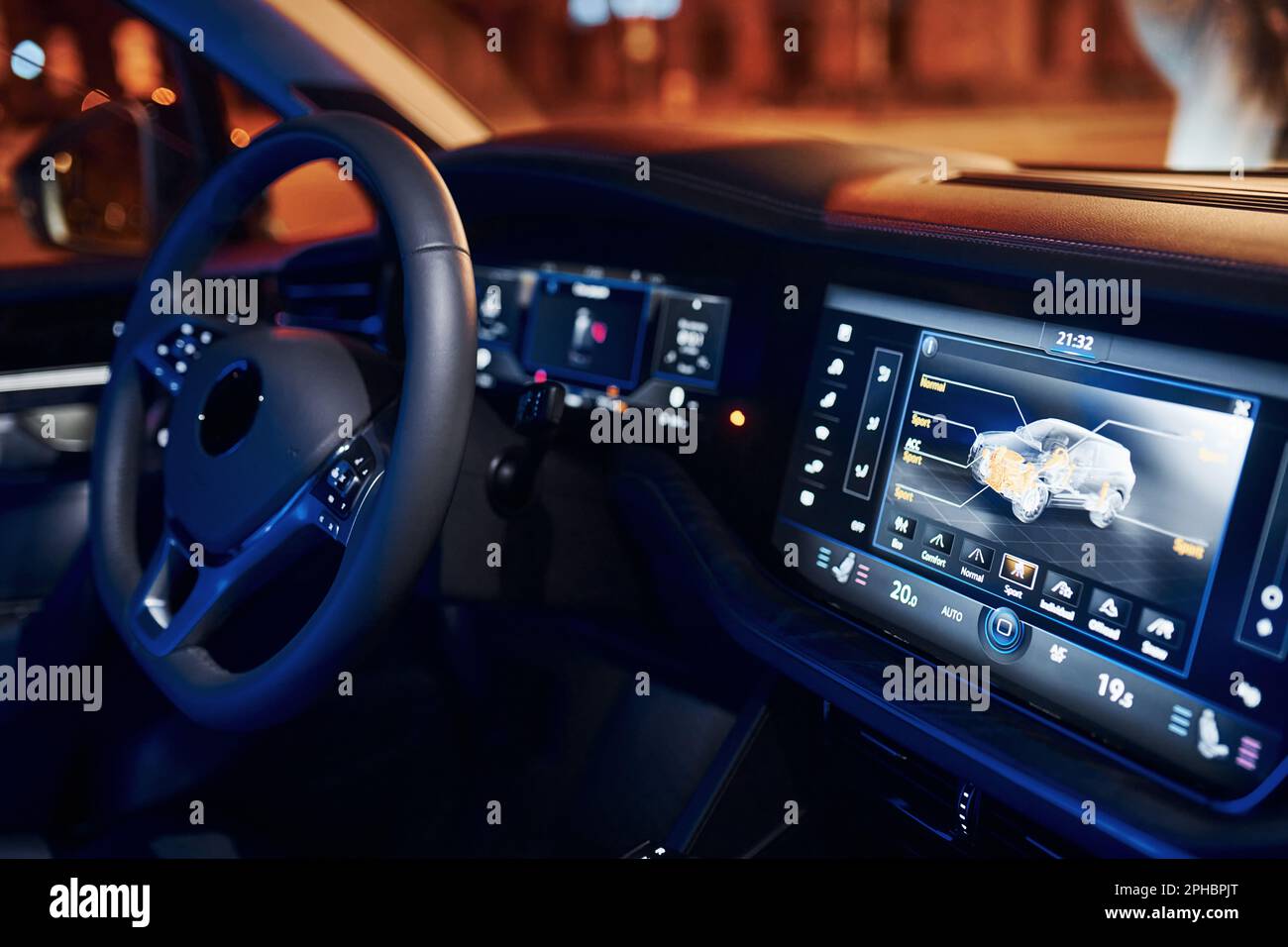 Steering wheel and navigation display. Close up view of front park of ...
