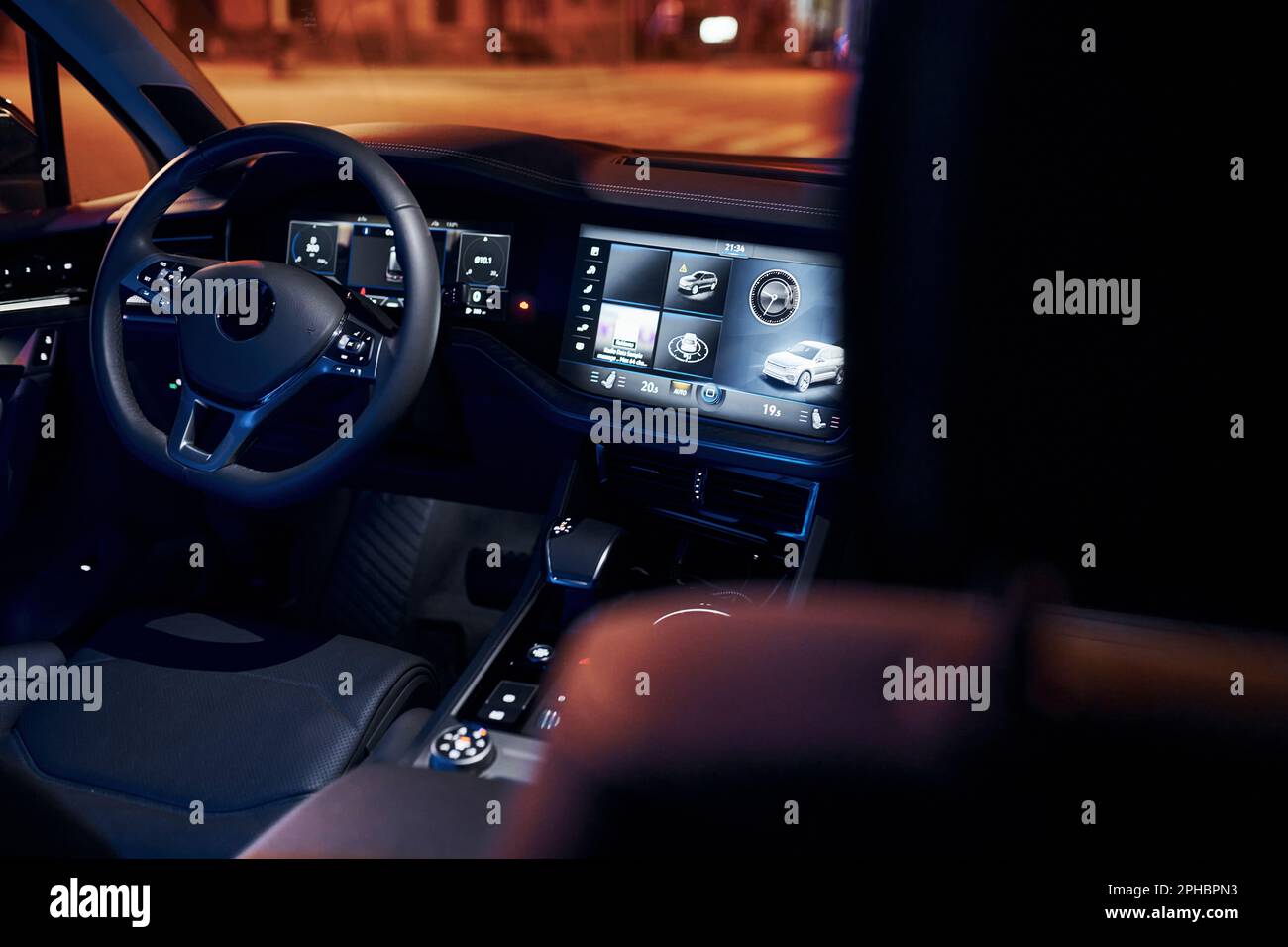 Steering wheel and navigation display. Close up view of front park of ...