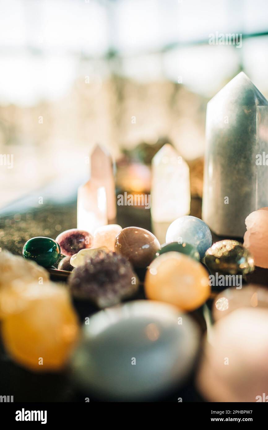 Variety of gemstones arranged on table at retreat center Stock Photo ...